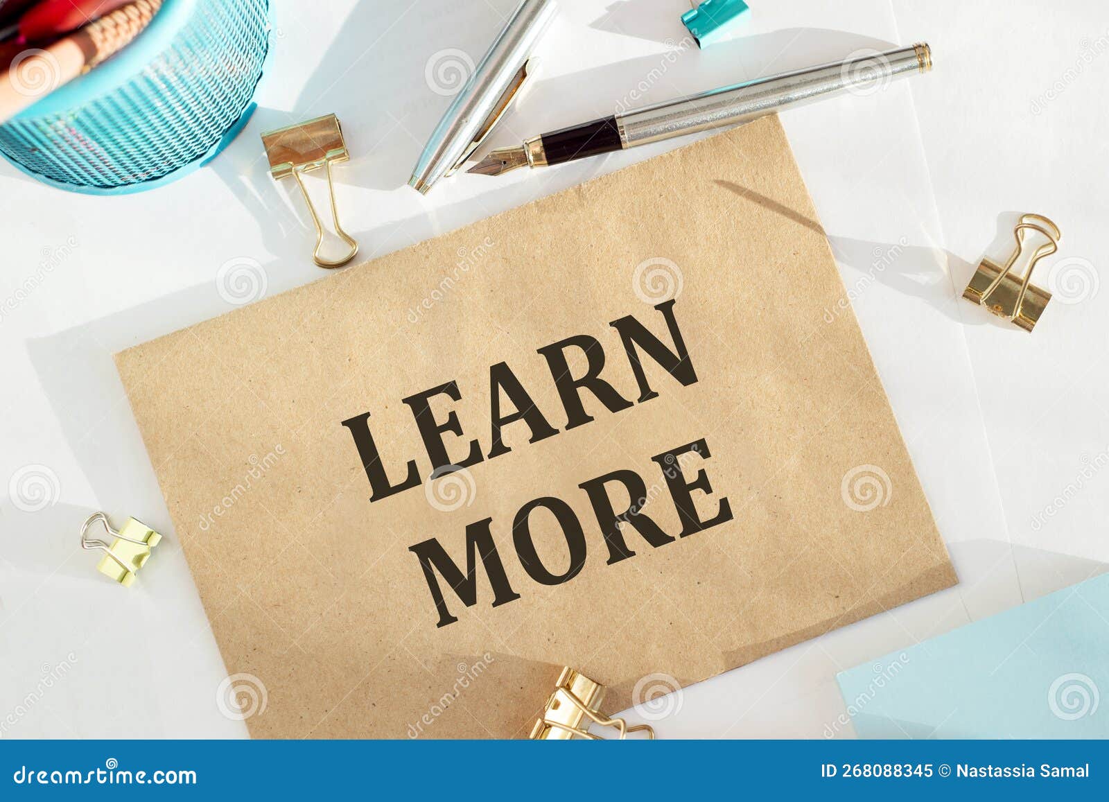 LEARN MORE Text on Notebook with Pen and Table Stock Image - Image of ...