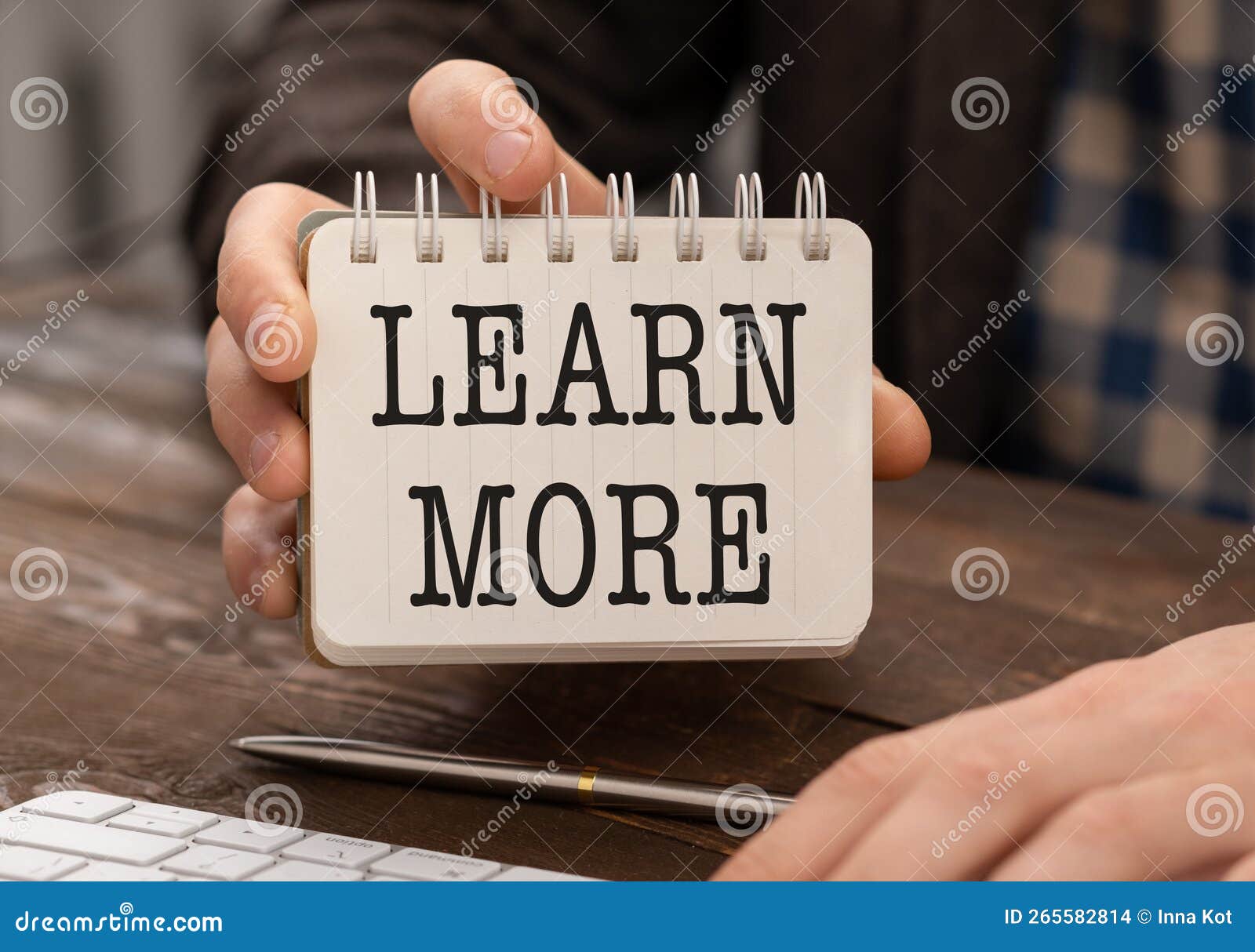 Learn More Text Written on a Notebook in Hand, Business Concept. Stock ...