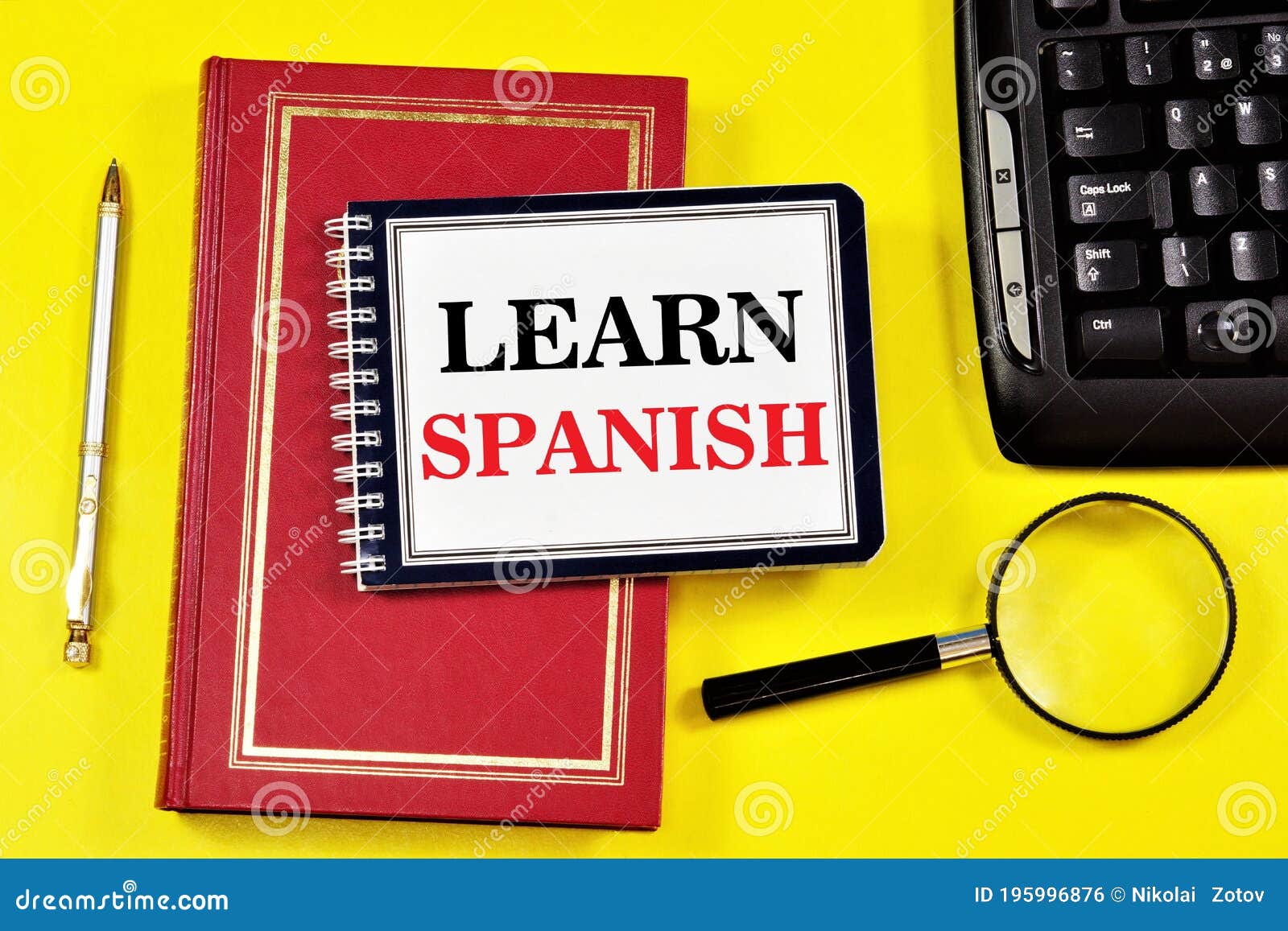 Learn Spanish.- Writing Text in a Notebook on a Textbook Stock Photo ...