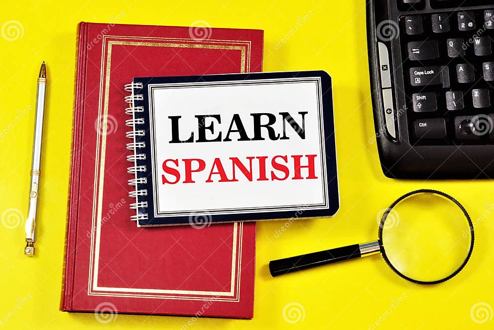 Learn Spanish.- Writing Text in a Notebook on a Textbook Stock Photo ...