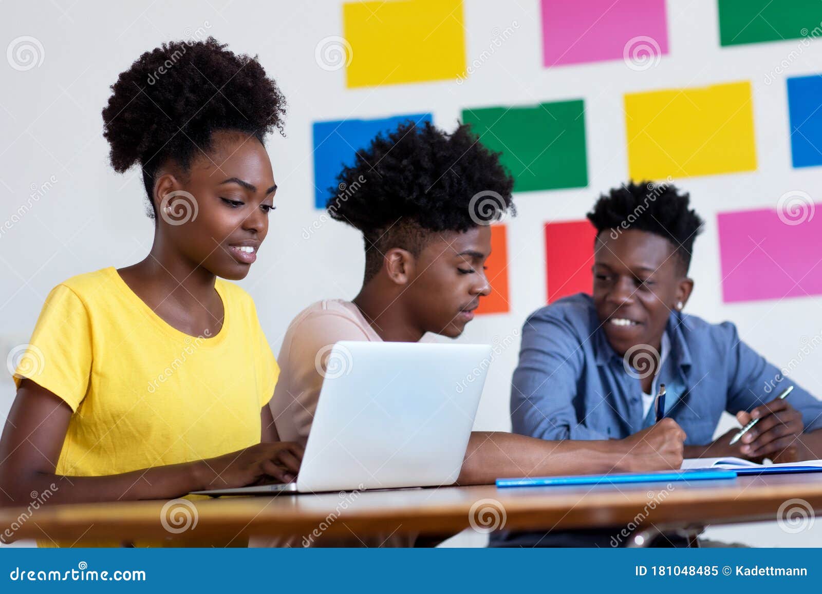Learning African American Female Student at Computer with Group of ...