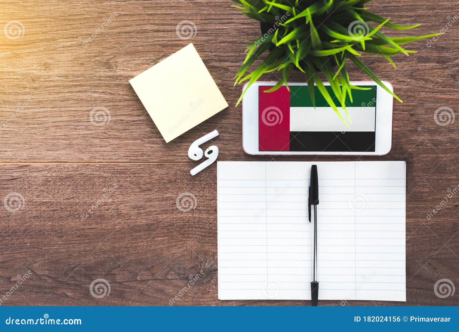 Learning Arabic, a Smartphone with the Flag of the UAE and a Notebook ...