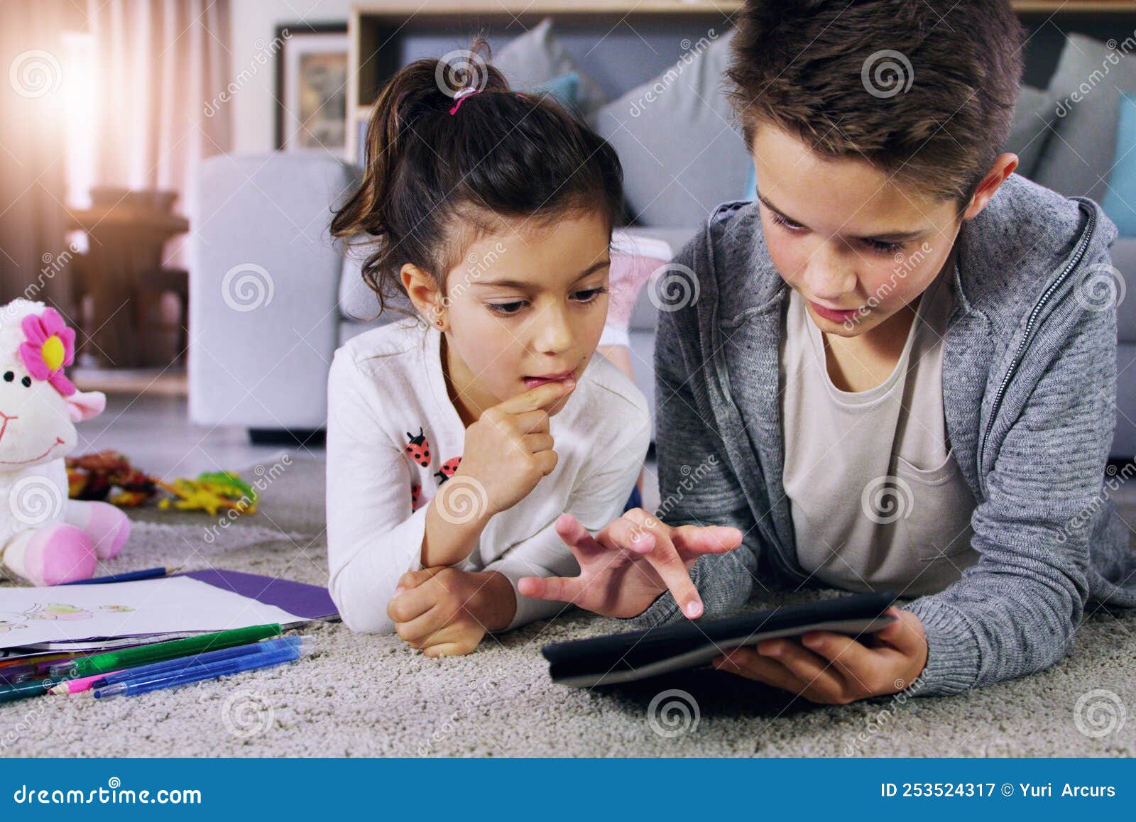 Learning is As Easy As One, Two, Tap. a Brother and Sister Using a ...