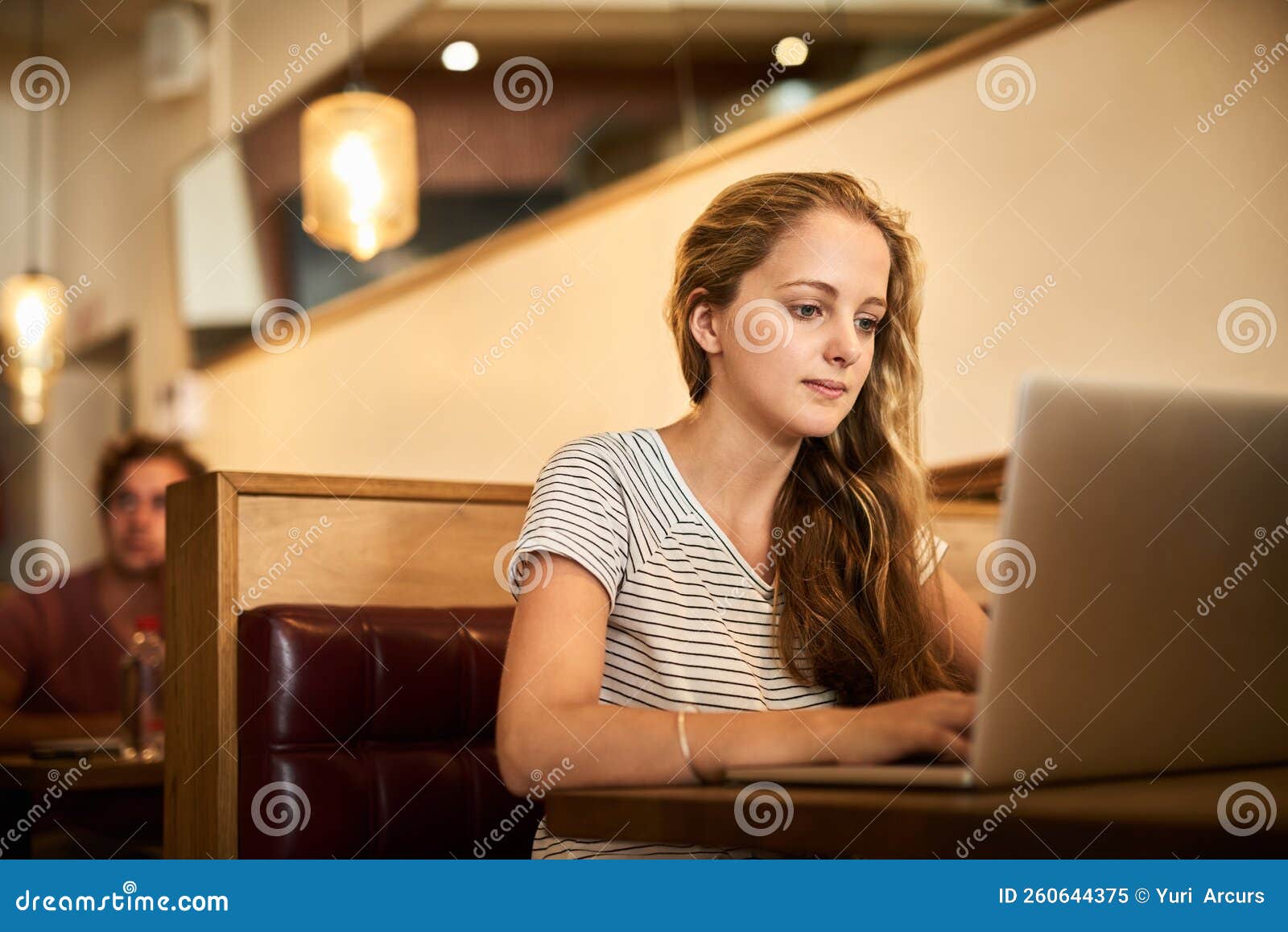 Learning As she Writes. a Focussed Young Student Using Her Laptop To ...