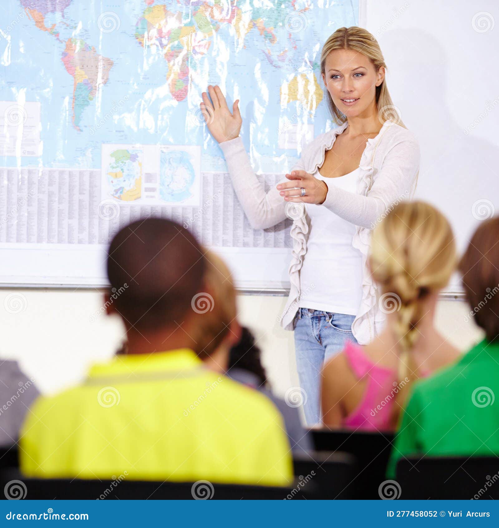 Learning the Basics. a Young Teacher Teaching a Geography Lesson To Her ...