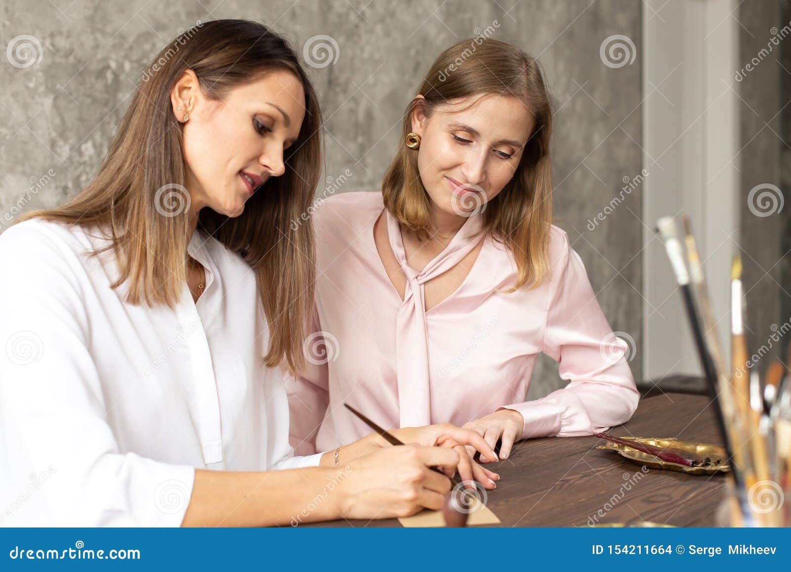 Learning Calligraphy in Art Workshop. Teacher and Students. Art School ...