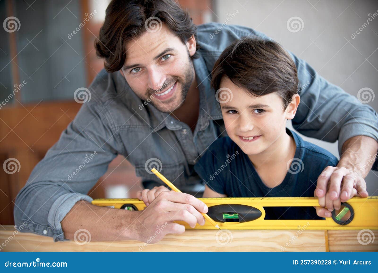 Learning about Carpentry from Dad. a Father and Son Doing Woodwork ...