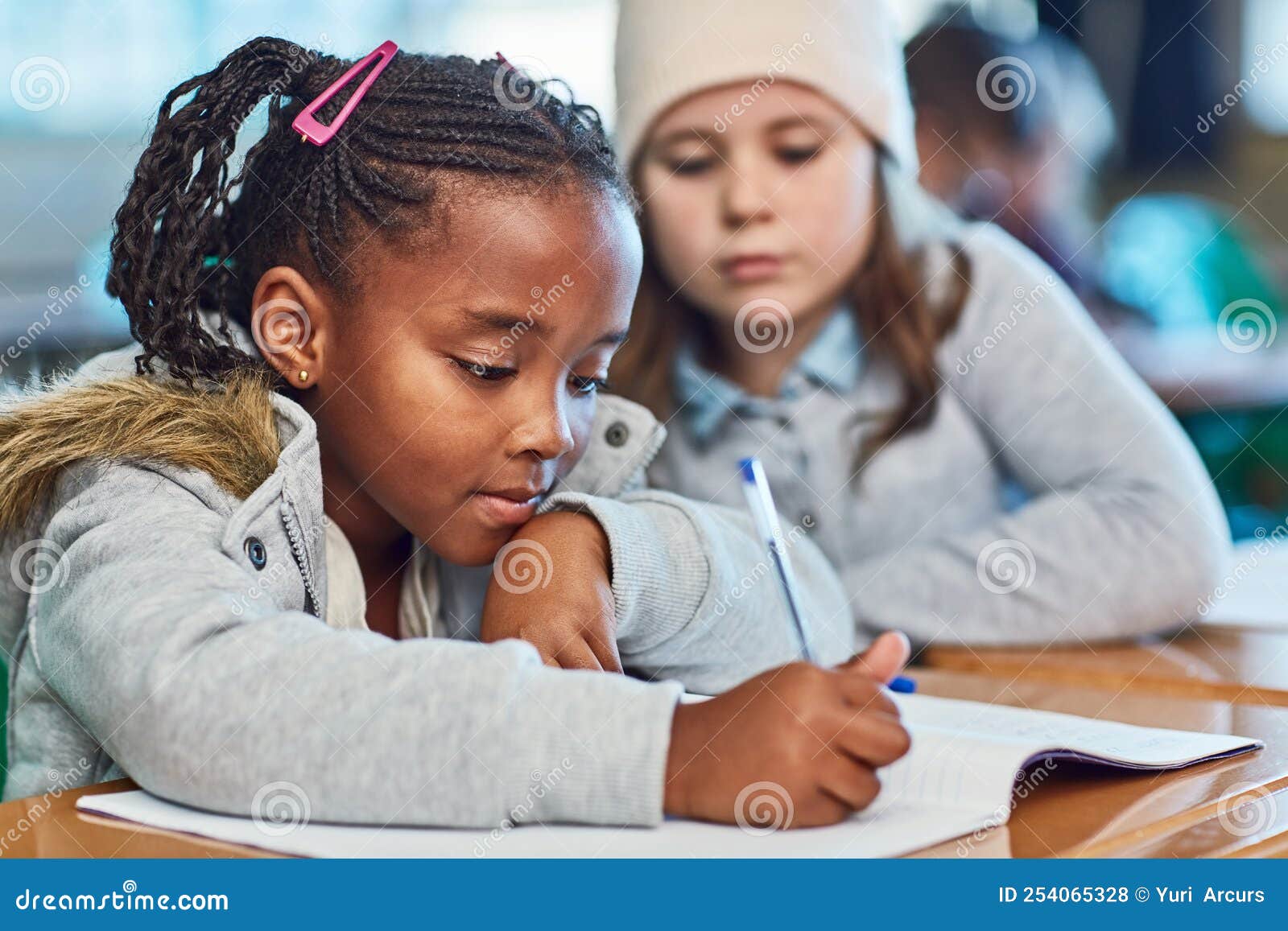 Learning from Each Other. Elementary School Girls Doing School Work ...