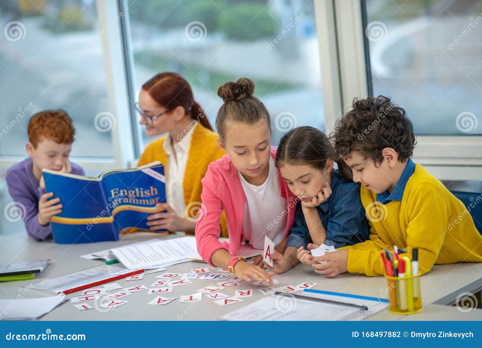 Concentrated Children Learning English Grammar at School Stock Photo ...