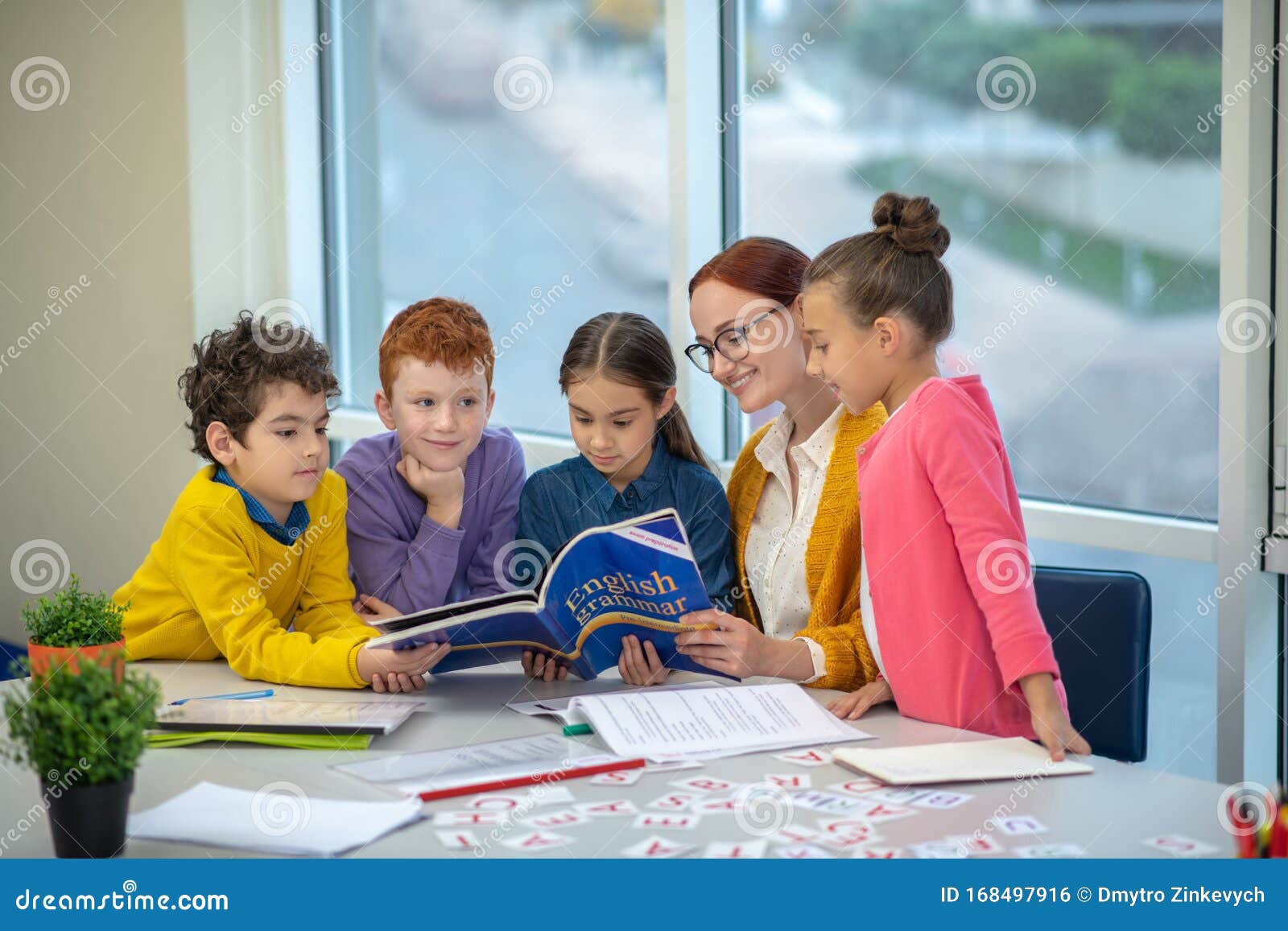 Children Reading a Book during Their English Class Stock Photo - Image ...