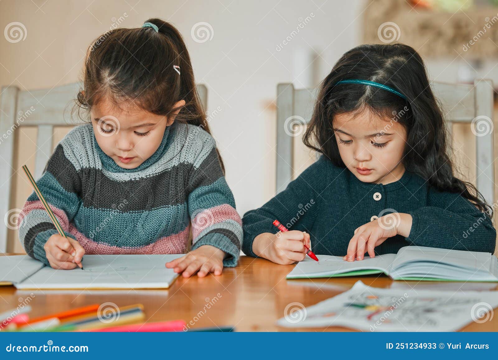 Learning is always Fun. Two Sisters Completing Their Homework Together ...