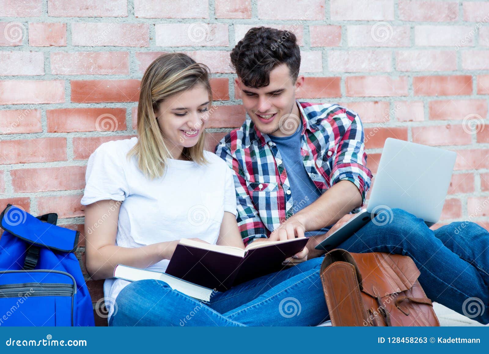Learning German Students with Book and Laptop Stock Image - Image of ...
