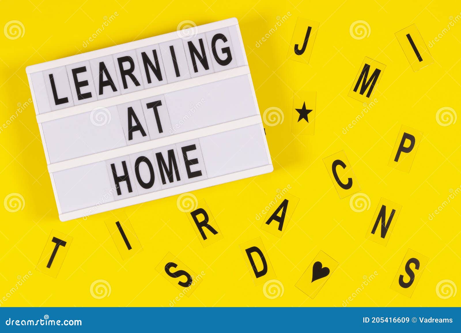 Learning at Home Message on Lightbox and Letters on Yellow Background ...