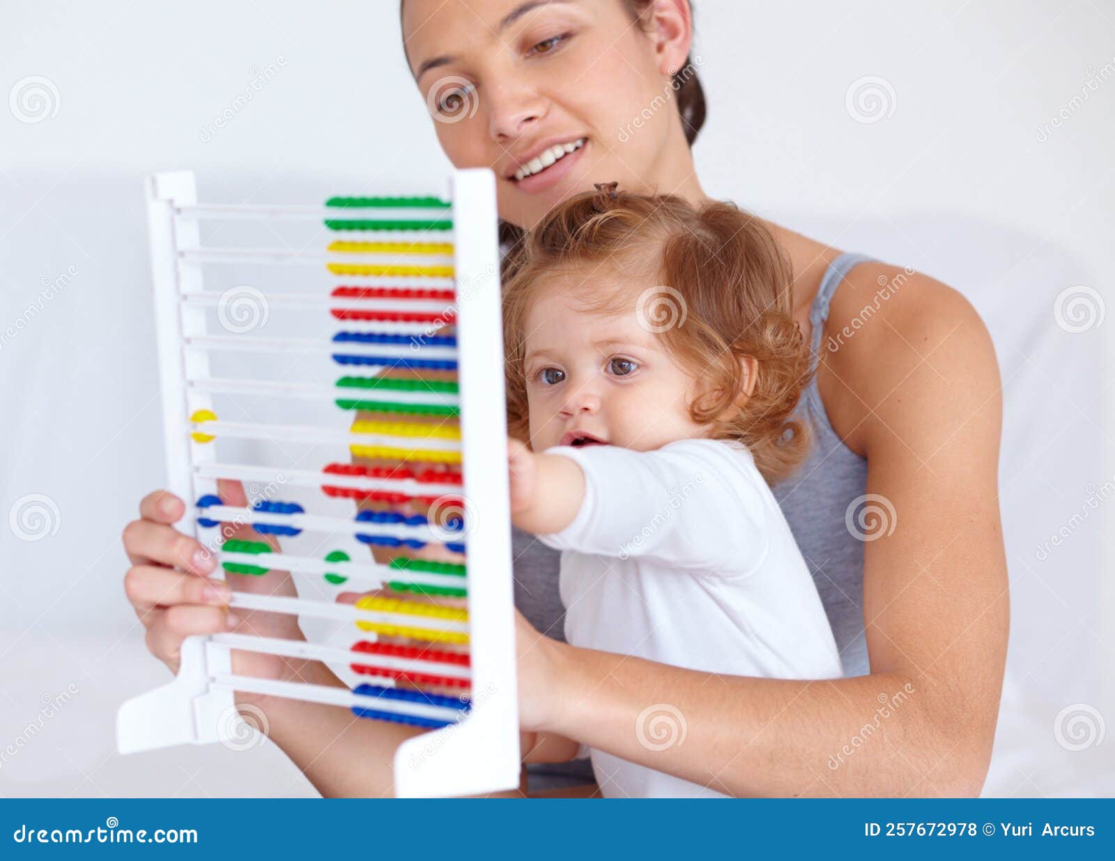 Learning at Home. a Young Mother Teaching Her Baby Daughter the Basics ...