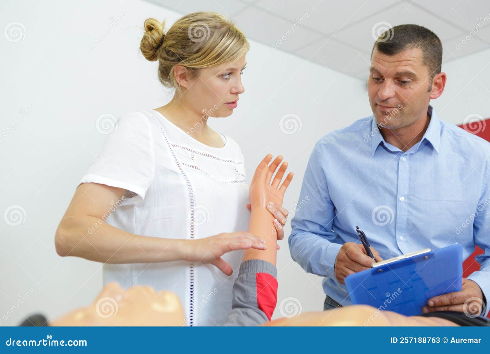 Learning How To Make First Aid Heart Compressions with Dummy Stock ...