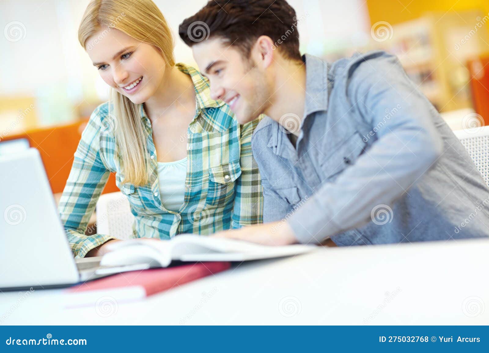 Learning on a Laptop. Two Smiling Students Helping Each Other with ...