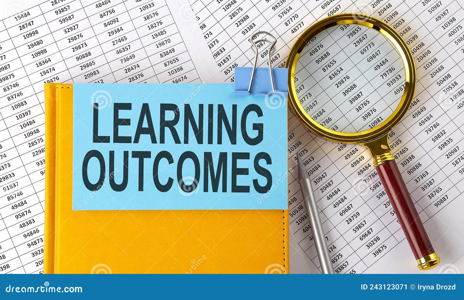 LEARNING OUTCOMES Text on Sticker on Notebook with Magnifier and Chart ...