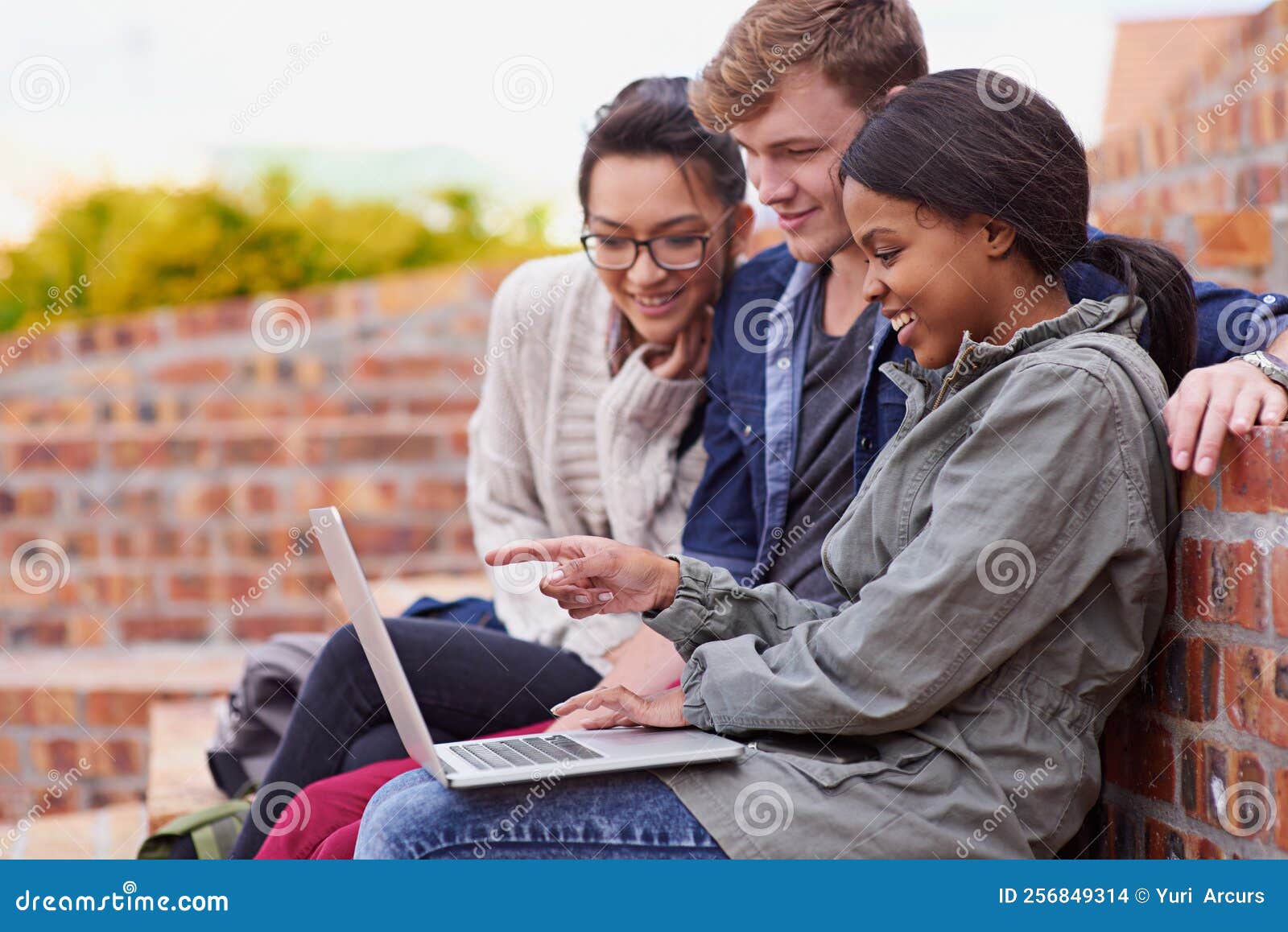Learning is Pleasurable. a Group of Students Sitting Outside while on ...