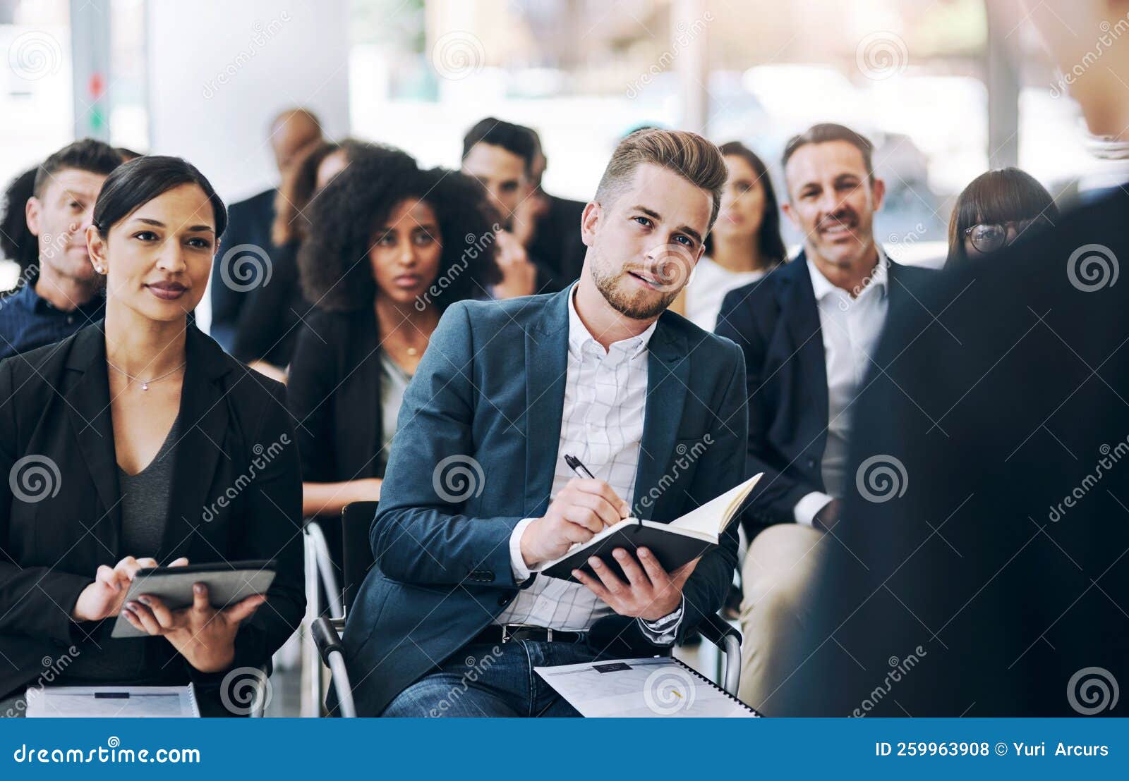 Learning from the Professionals. a Group of Businesspeople Sitting in ...