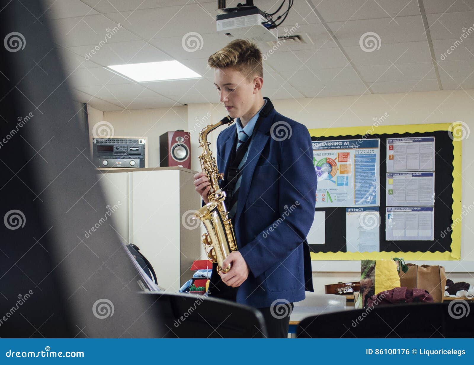 Learning Saxaphone at School Stock Photo - Image of juvenile ...