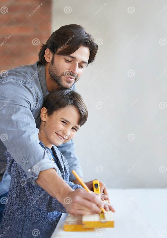 Learning the Secrets of DIY. a Father and Son Doing Woodwork Together ...