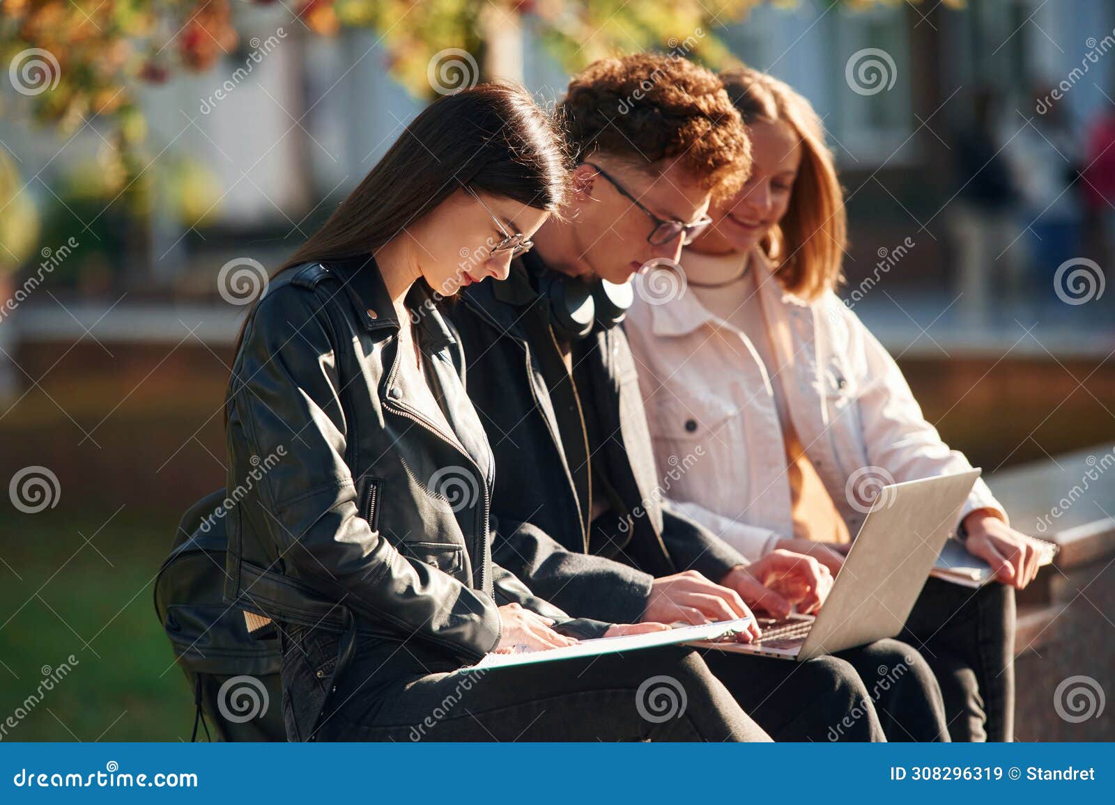 Learning, Sitting and Using Laptop. Three Young Students are Outside ...