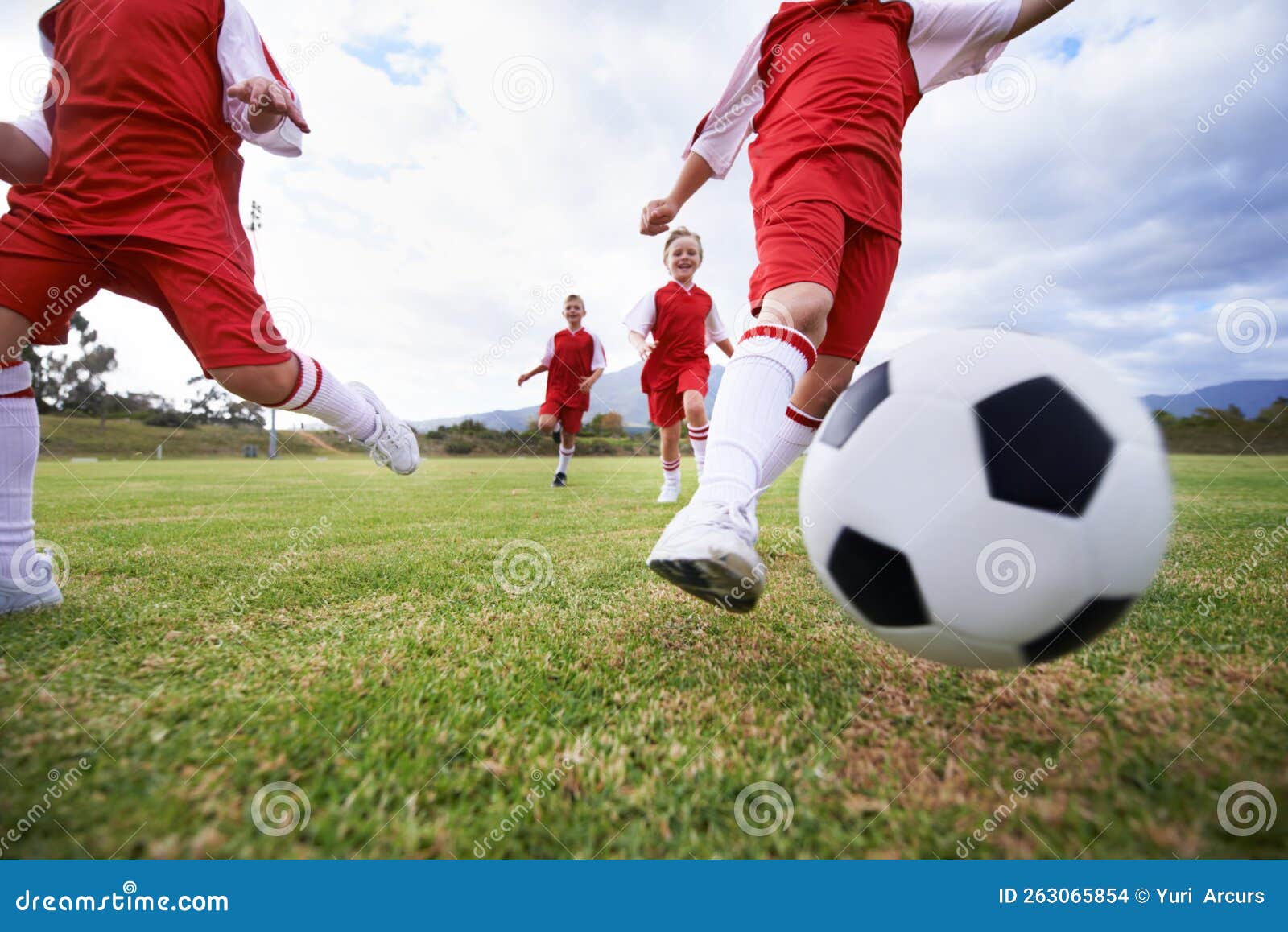 Learning Teamwork while Playing Together. Low Angle of Kids Playing ...