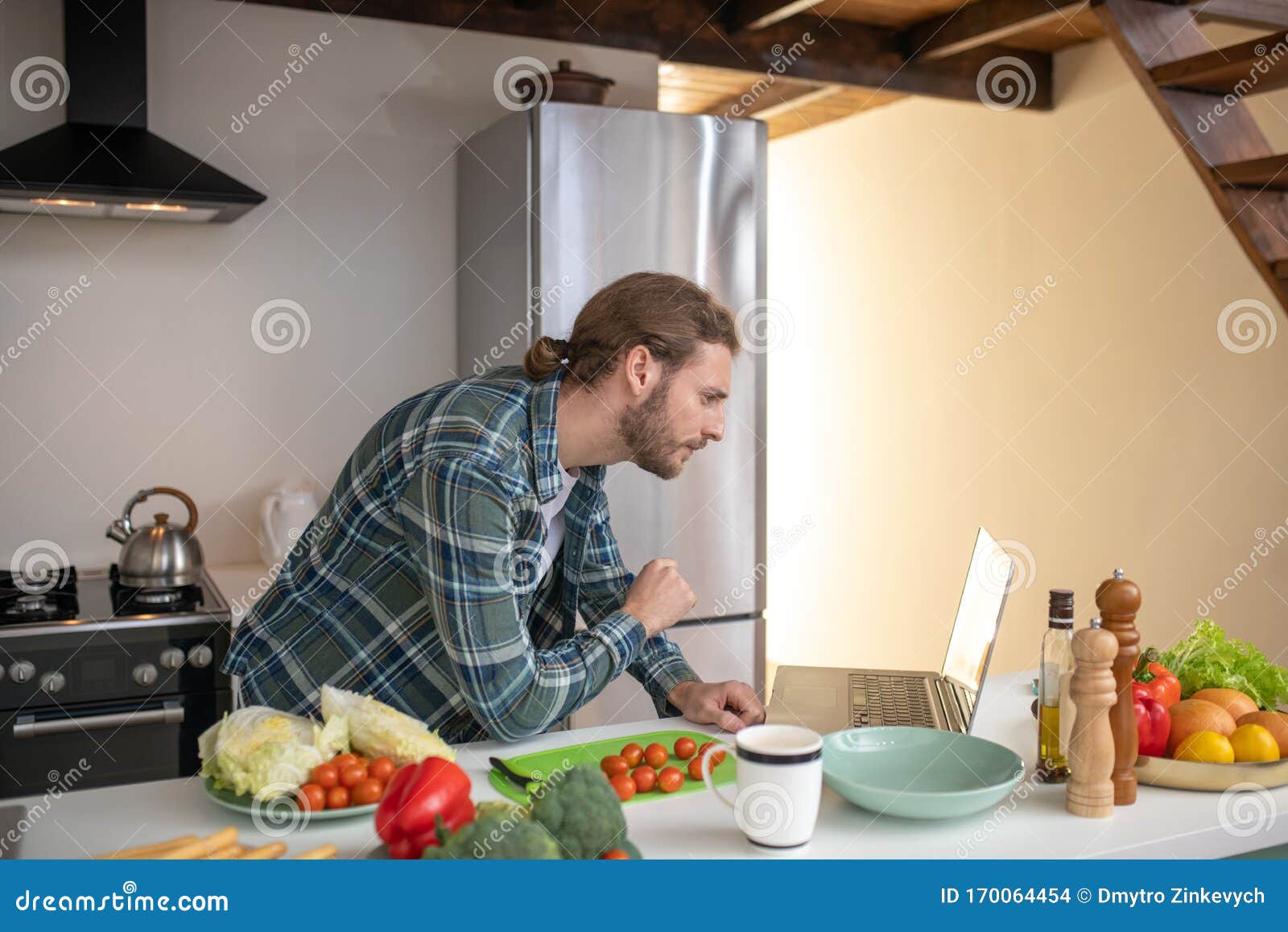 Man Watching Video Tutorials on Cooking a Salad Stock Photo - Image of ...