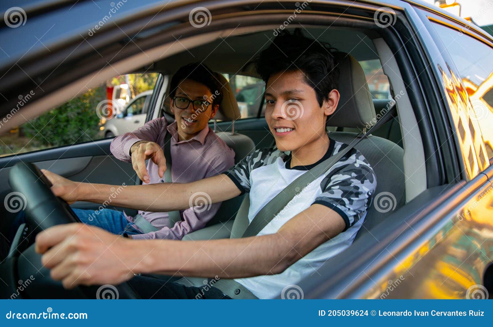 Learning To Drive. Two Young Men in a Driving Session Stock Photo ...
