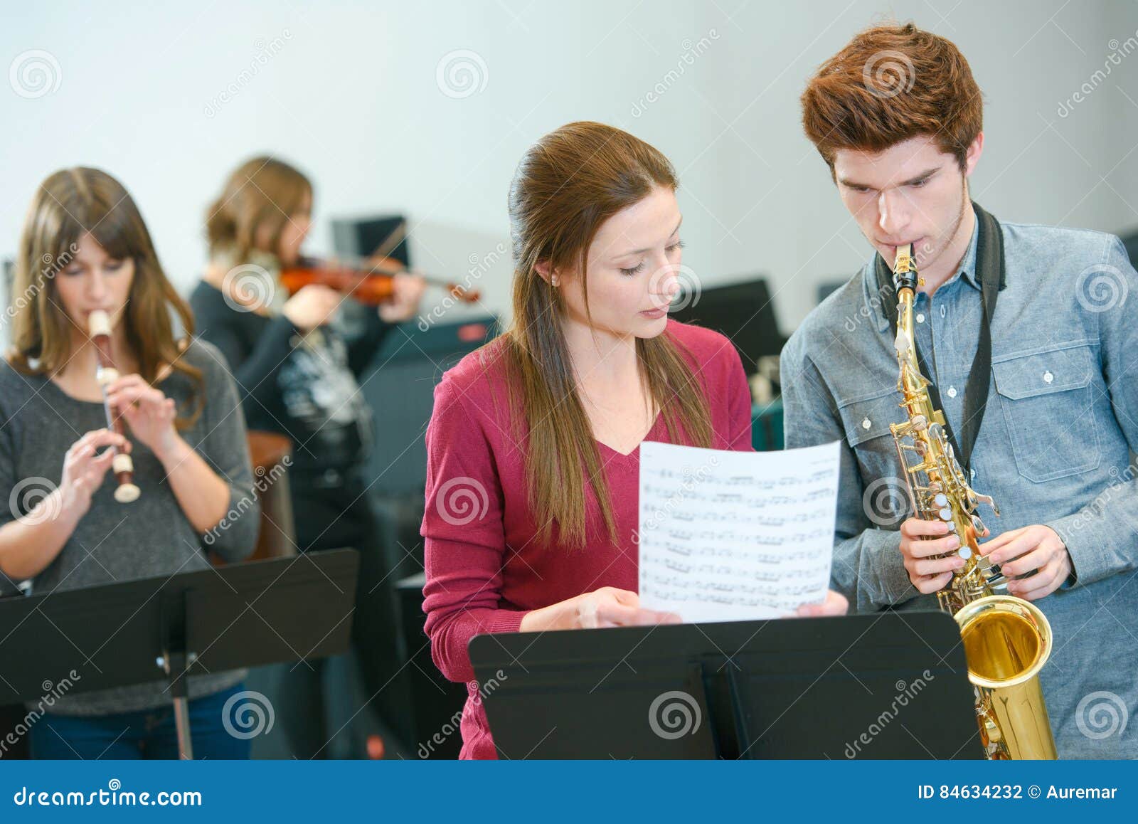 Learning to play sax stock photo. Image of brass, note - 84634232