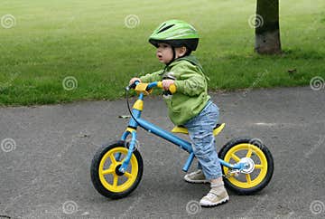 Learning To Ride on a First Bike Stock Image - Image of bicycling, game ...