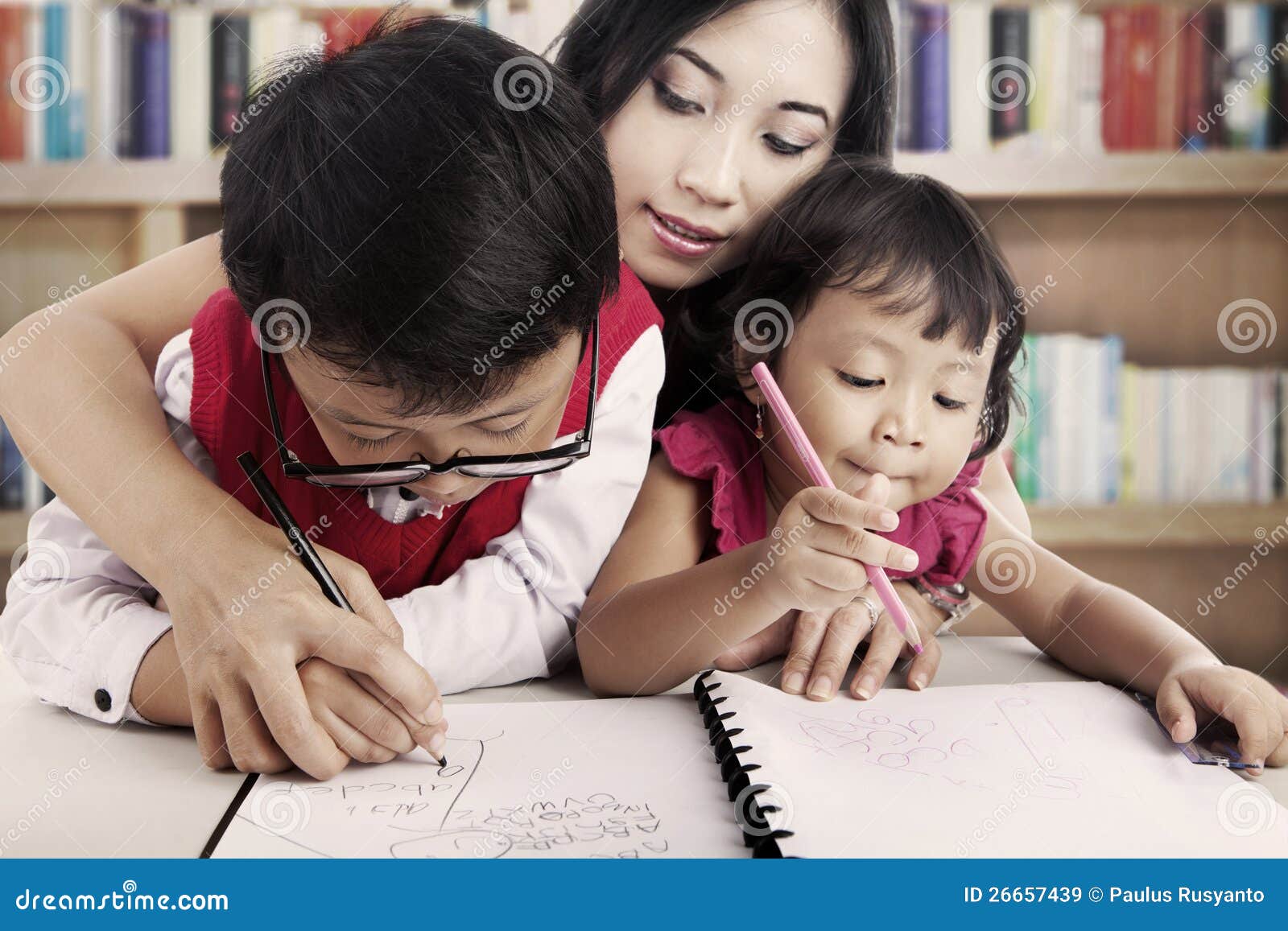Learning to write together stock image. Image of indonesian - 26657439