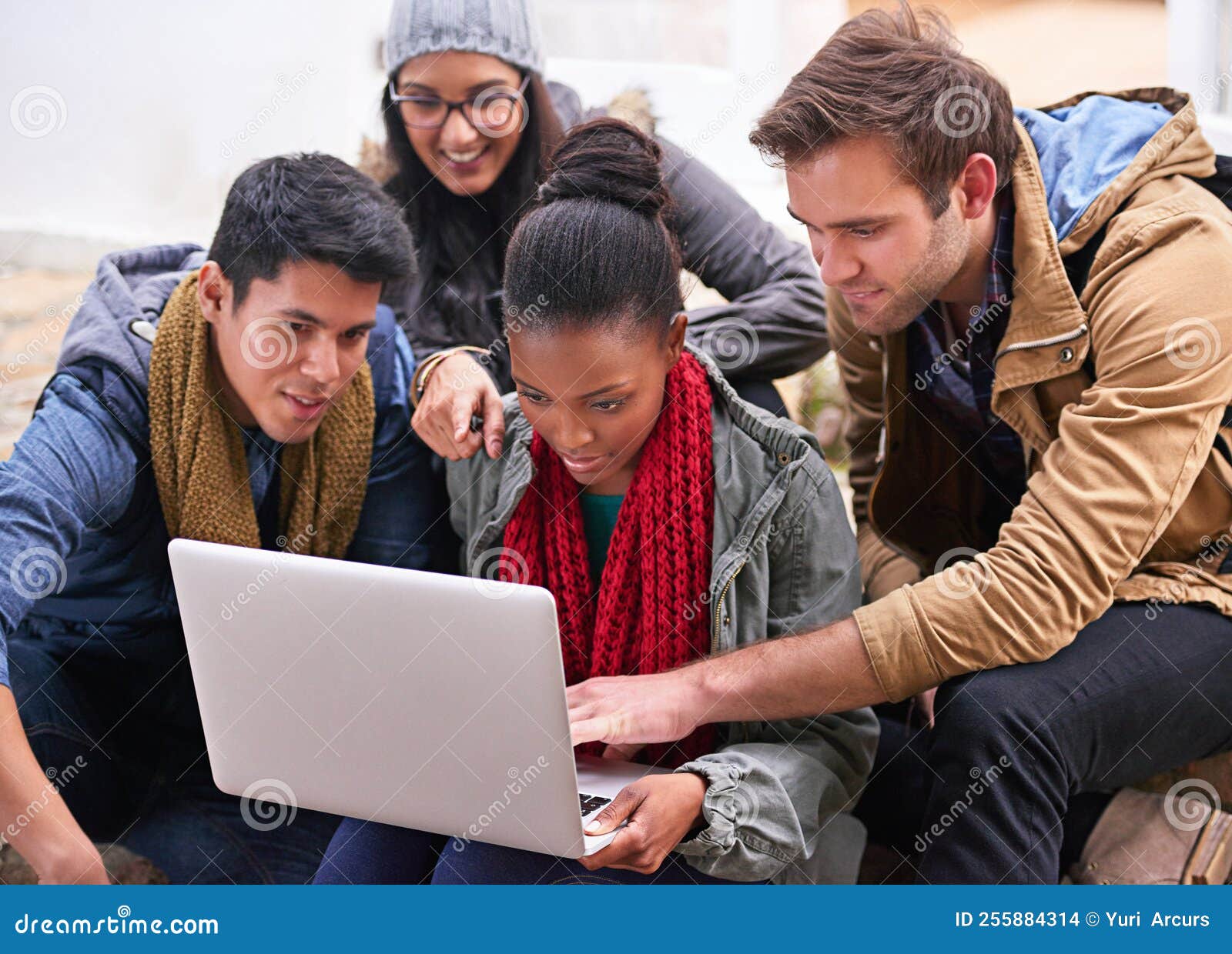 Learning Together. a University Students Using a Laptop while Sitting ...