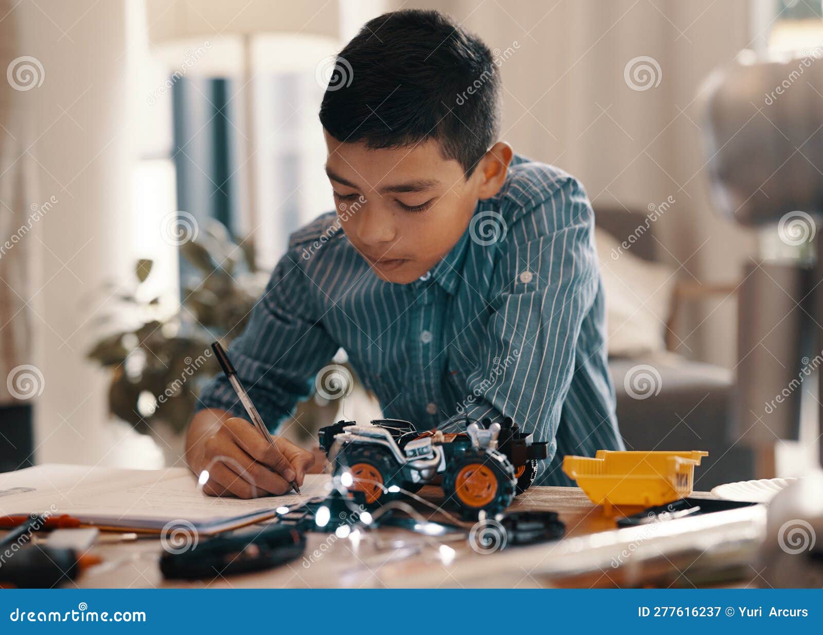 Learning, Writing in Notebook and Kid with Robotics Homework ...