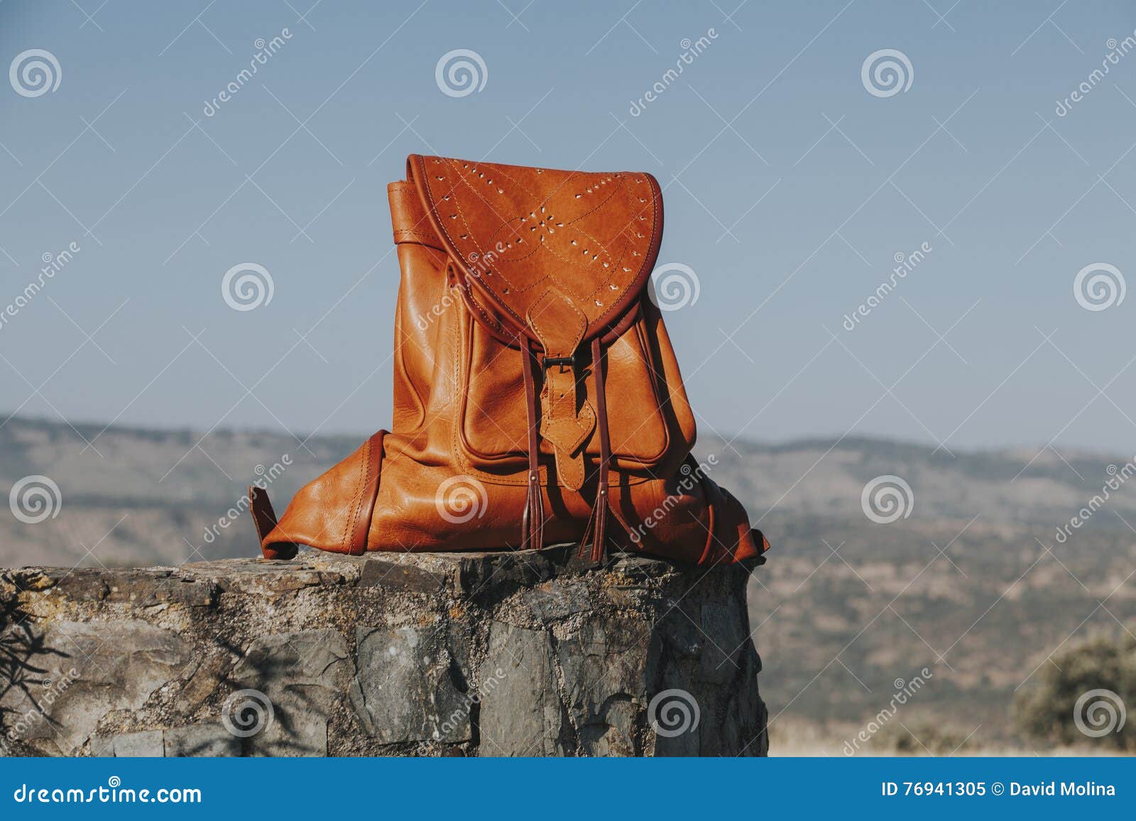 Leather Backpack in a Stone Wall at the Countryside. Stock Image ...