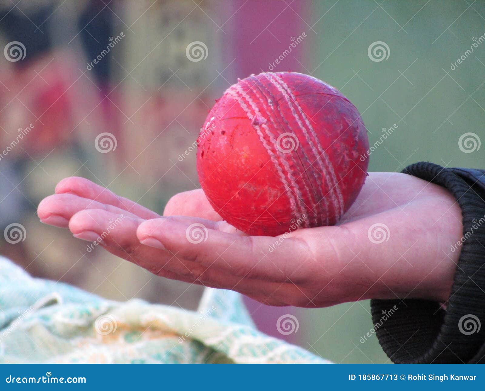 A leather ball in the hand stock image. Image of hand - 185867713