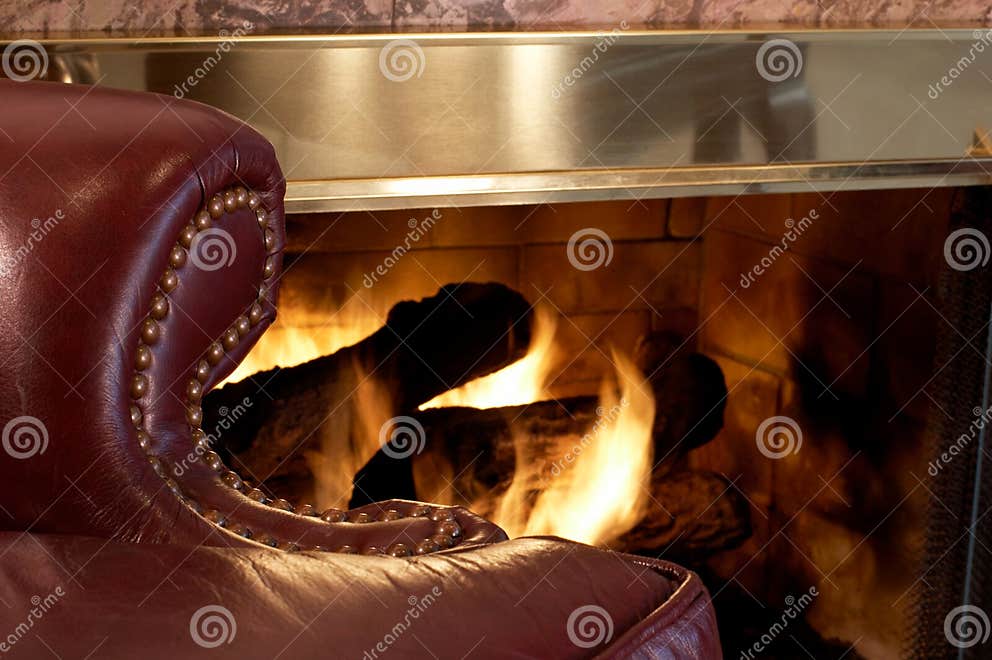 Leather chair by the fire stock photo. Image of leather - 20632244
