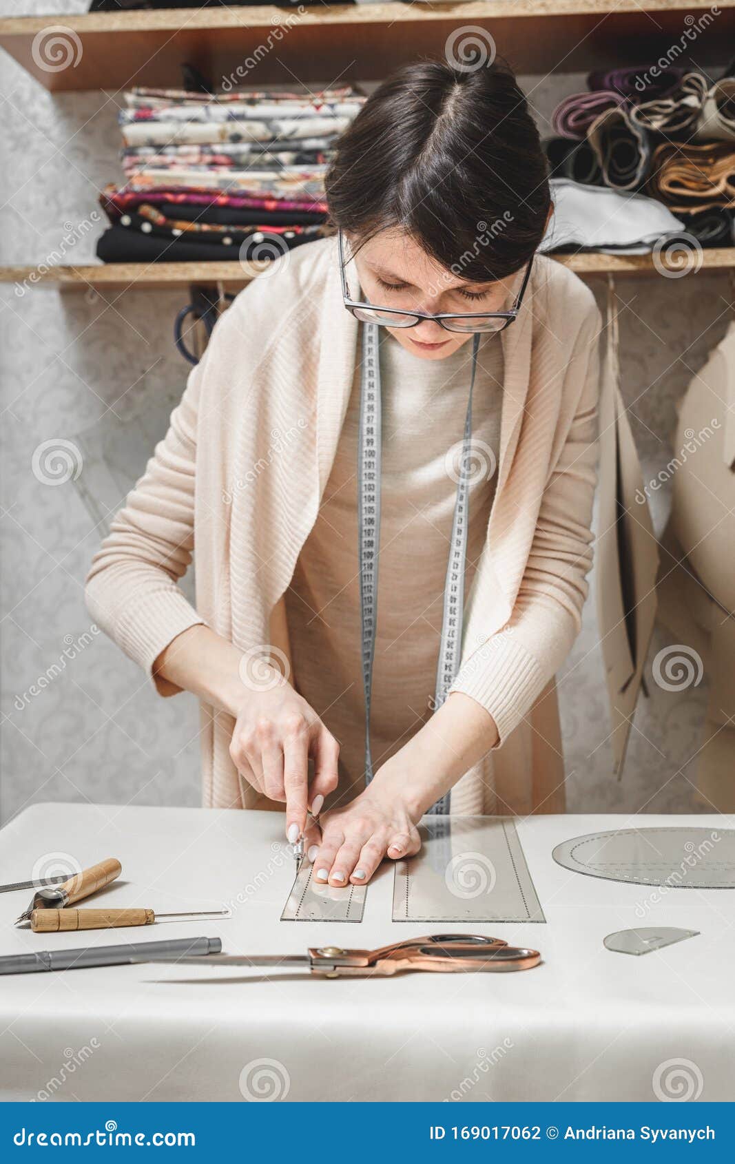 Woman Making Measurements in Patterns in Workshop Stock Photo - Image ...
