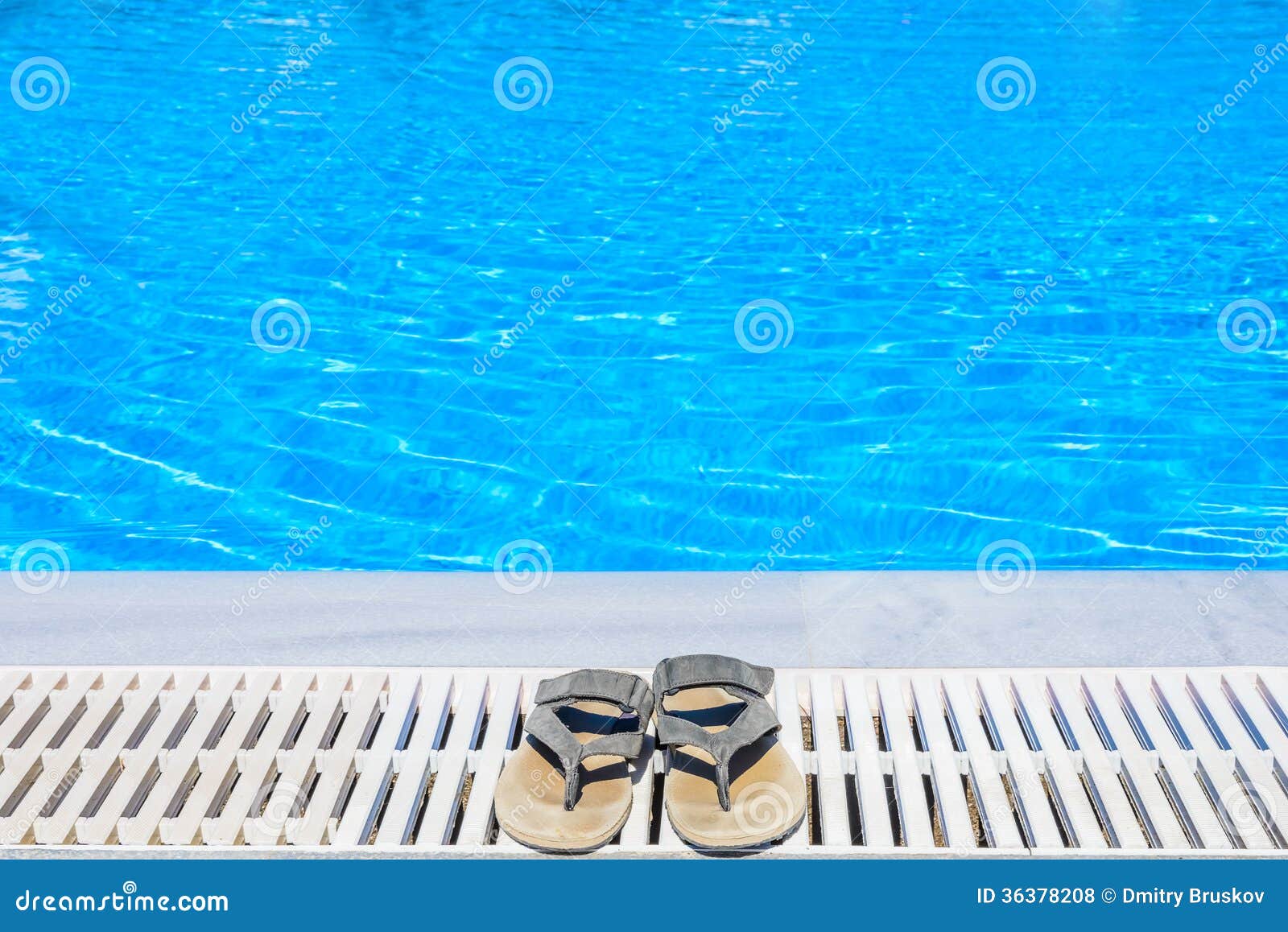 Leather Sandals are on the Edge of the Swimming Pool Stock Photo ...