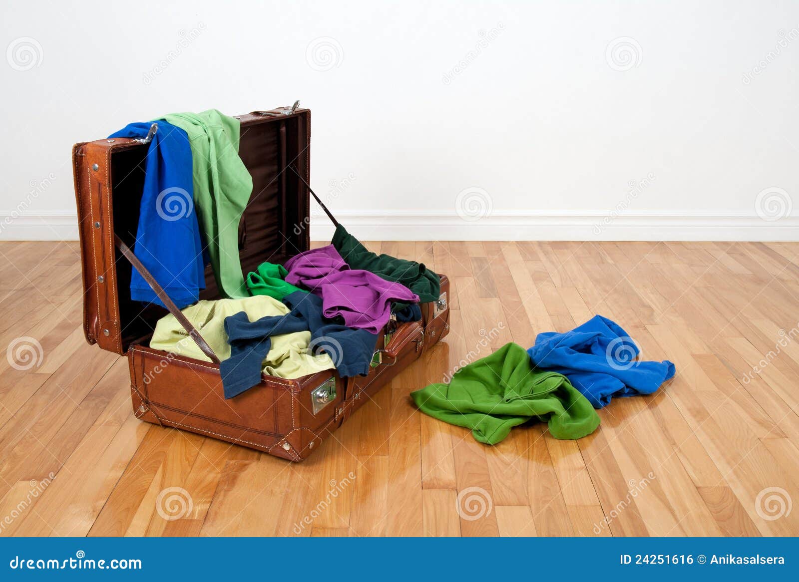 Leather Suitcase Full of Colorful Clothing Stock Photo - Image of ...