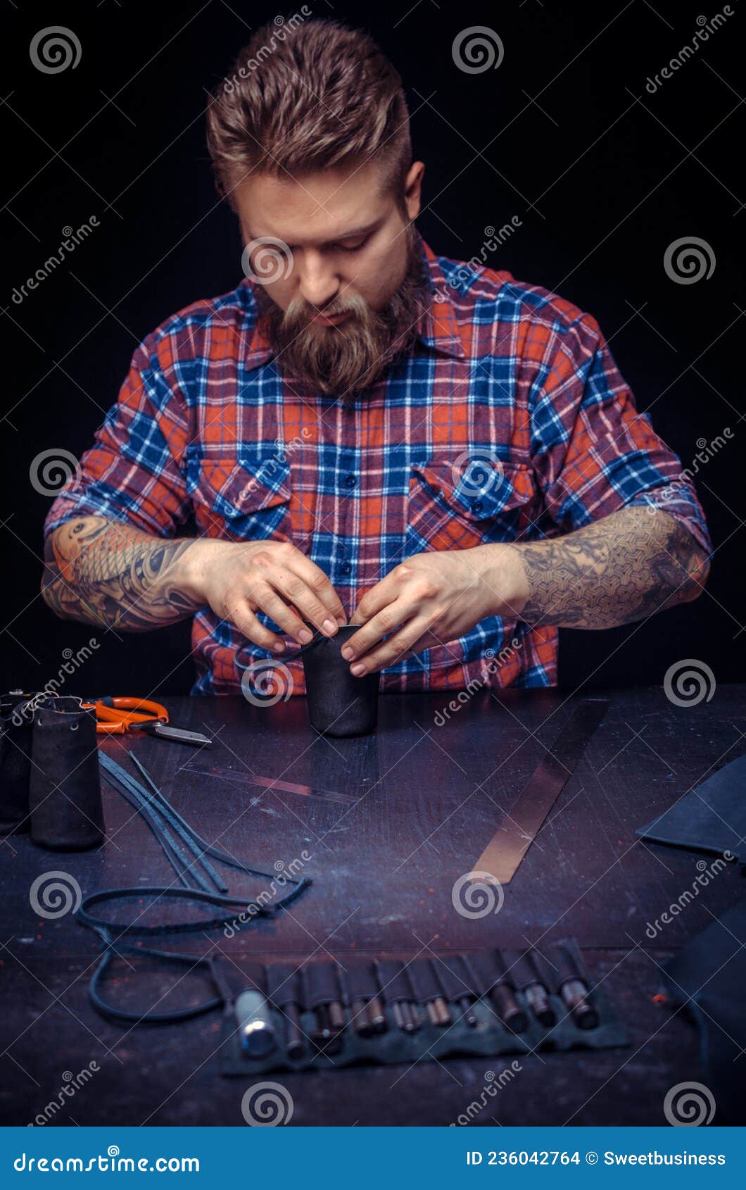 Leather Tanner Working with Leatherwork at the Tanning Shop Stock Photo ...