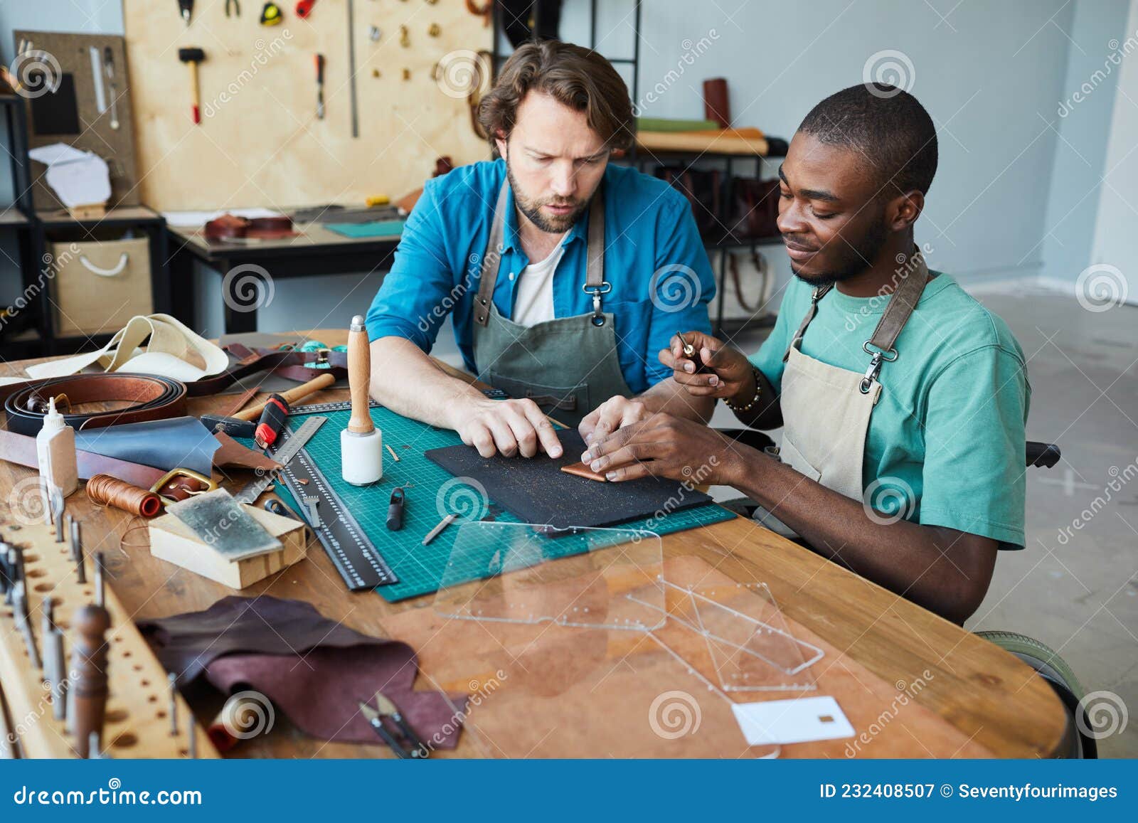 Leatherworker Teaching Young Man in Workshop Stock Image - Image of ...