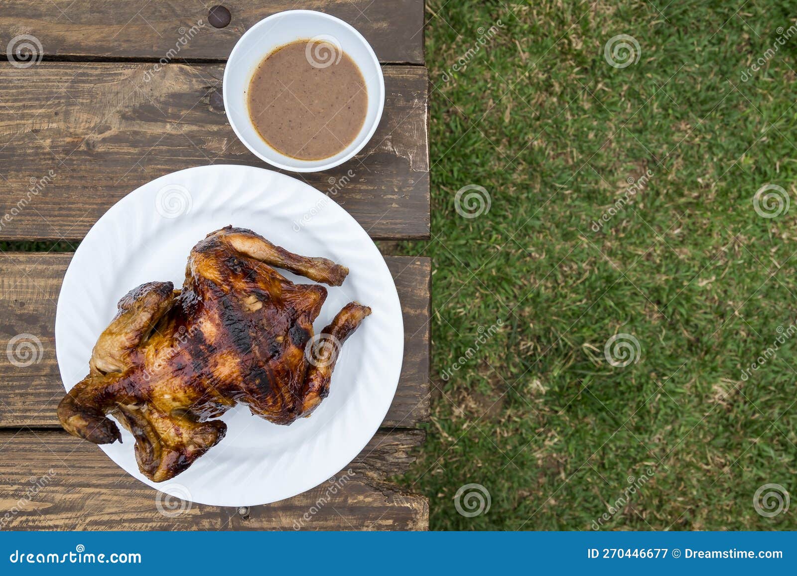 Lechon Manok, or Roasted Chicken Served Outside at a Bench with Gravy ...