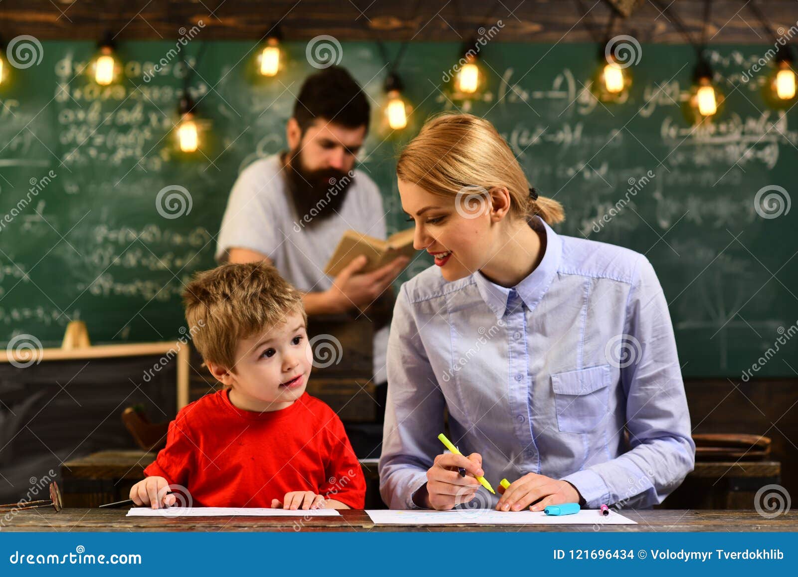 Lecturer Discussing Architectural Issues With Students During Workshop ...