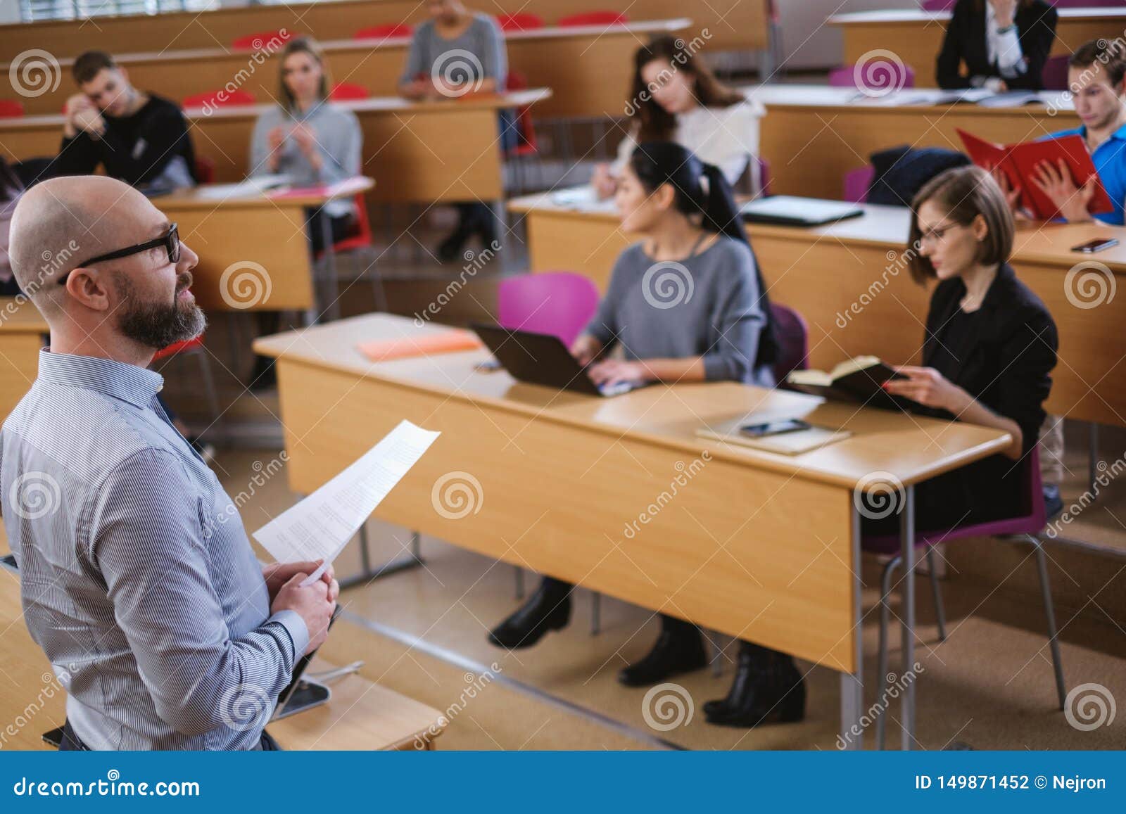 Lecturer And Multinational Group Of Students In An Auditorium Royalty ...