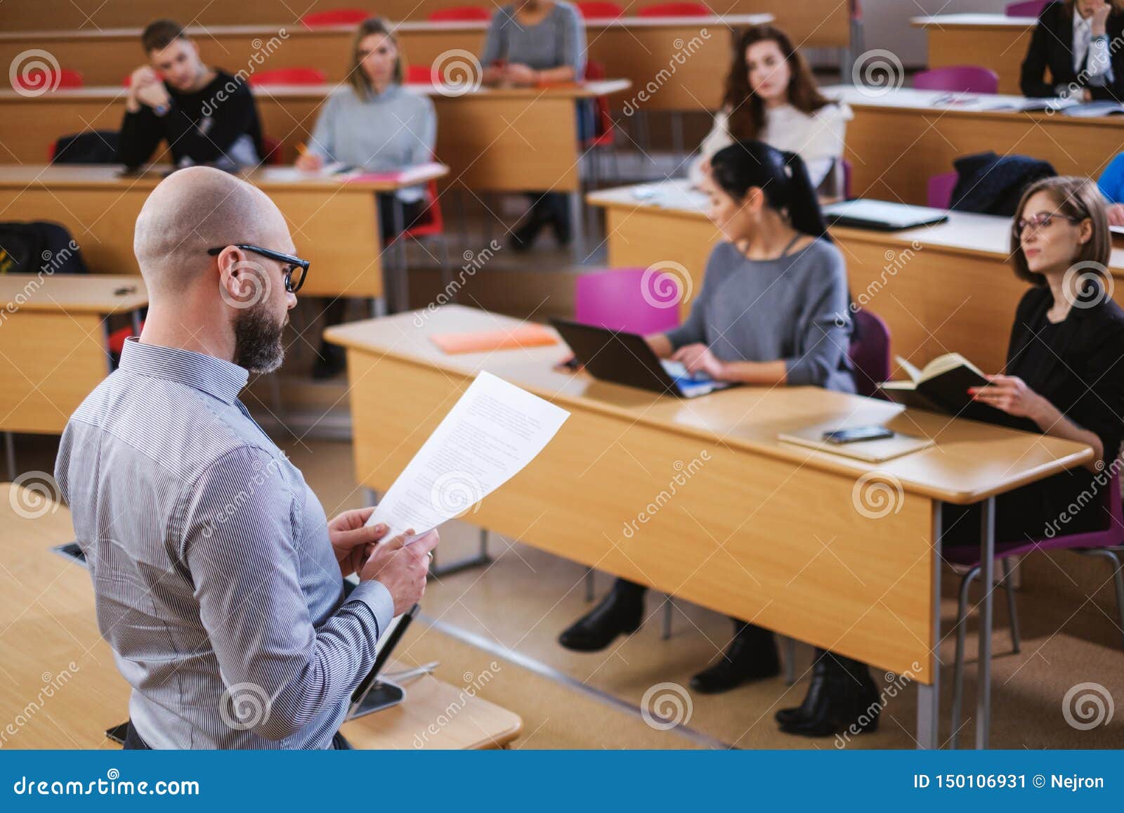 Lecturer And Multinational Group Of Students In An Auditorium Royalty ...