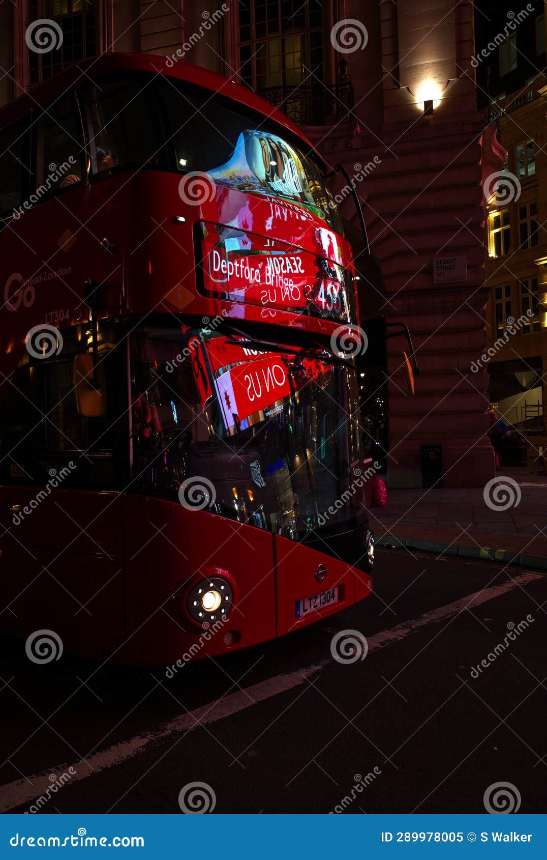 LED Billboard Lights, Reflected on Front Windows of London Bus ...