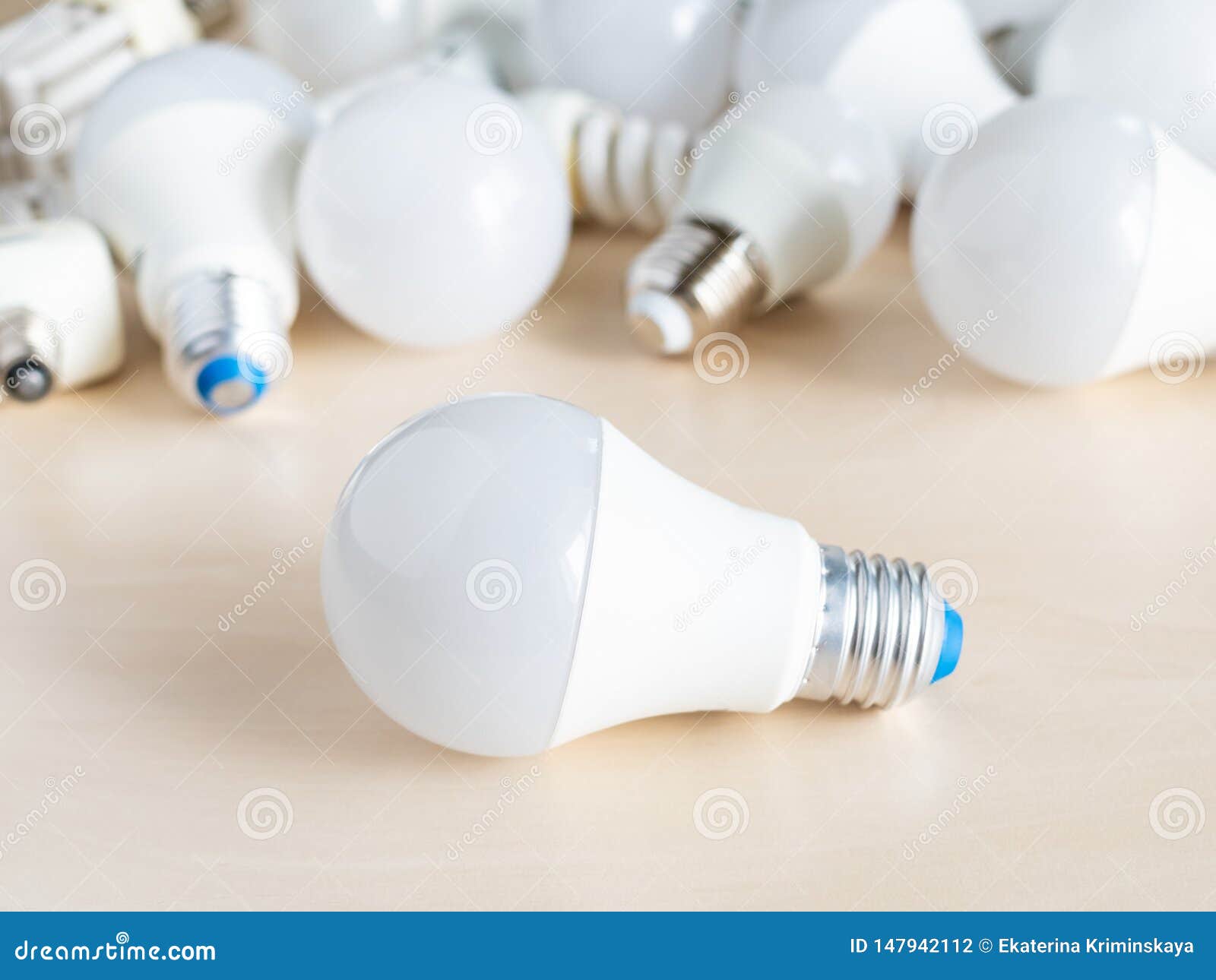 LED Bulb Light in Front of Pile from Various Lamps Stock Photo - Image ...