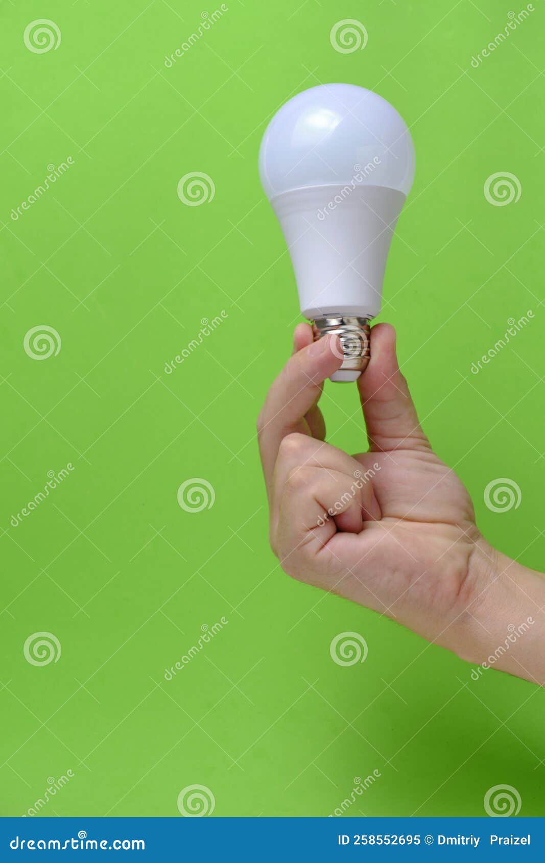 LED Eco Light Bulb in Hand on Green Background Stock Image - Image of ...