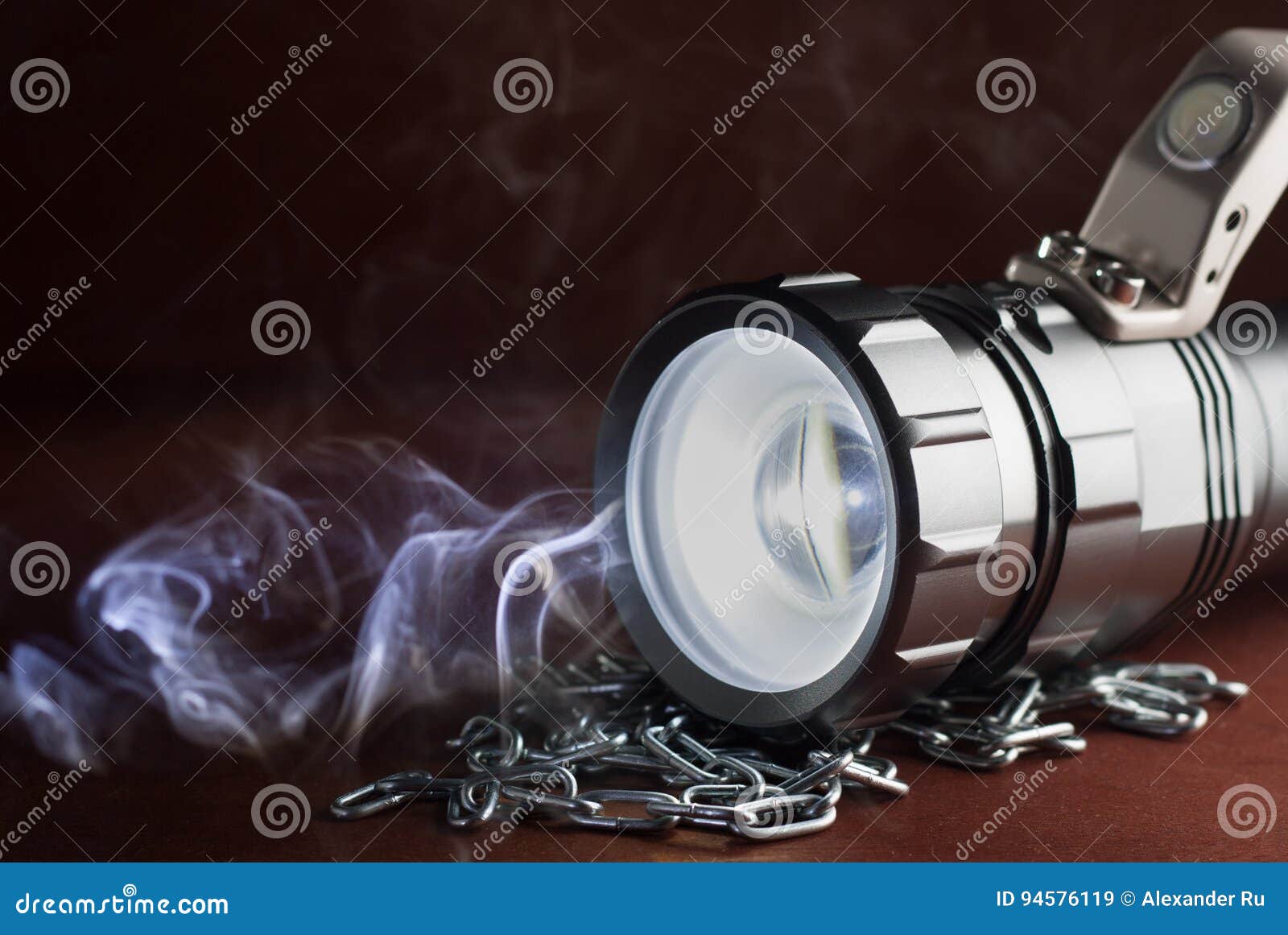 LED Flashlight on a Wooden Table in the Smoke. Stock Image - Image of ...